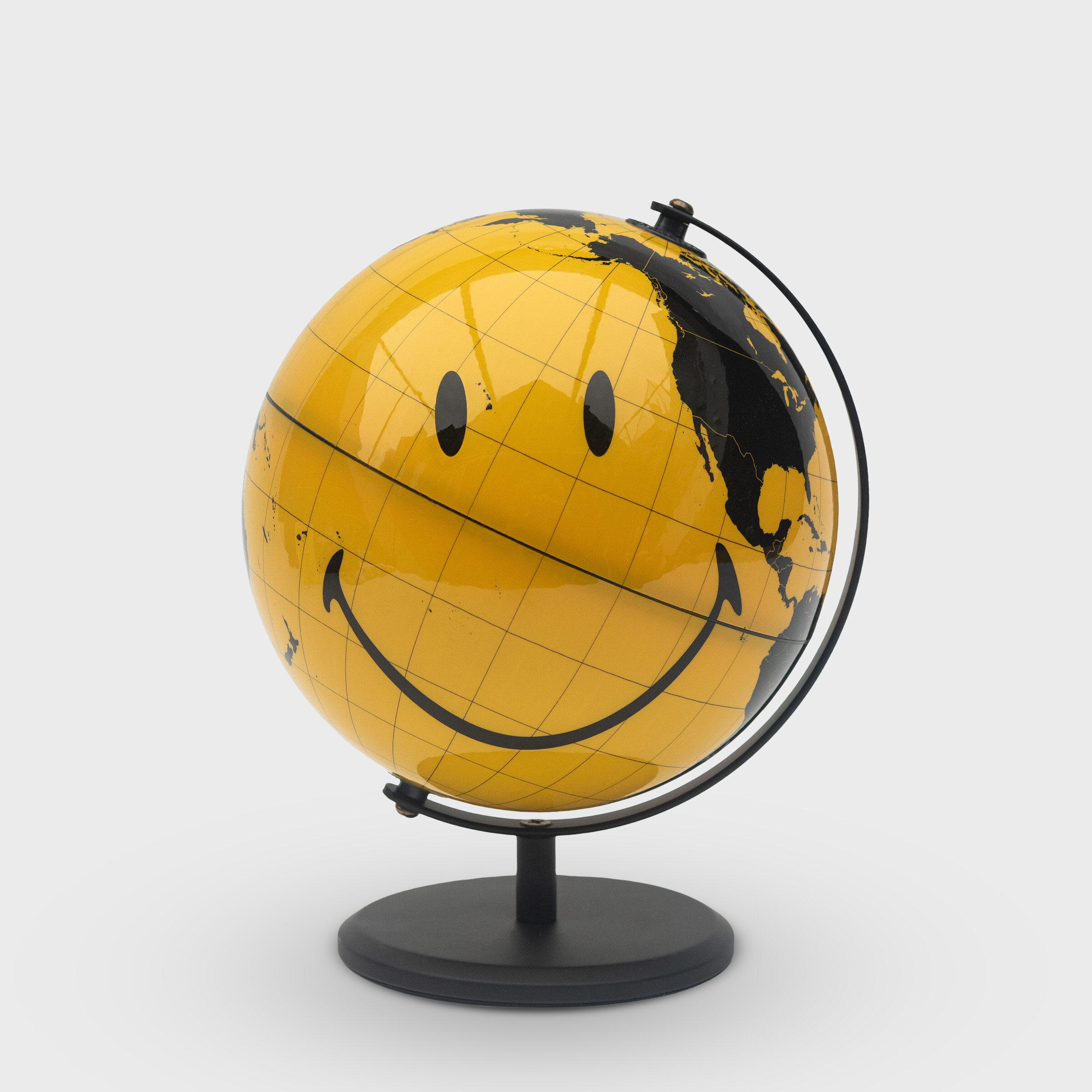Smiley® Globe : Yellow globe with a smiley face.
